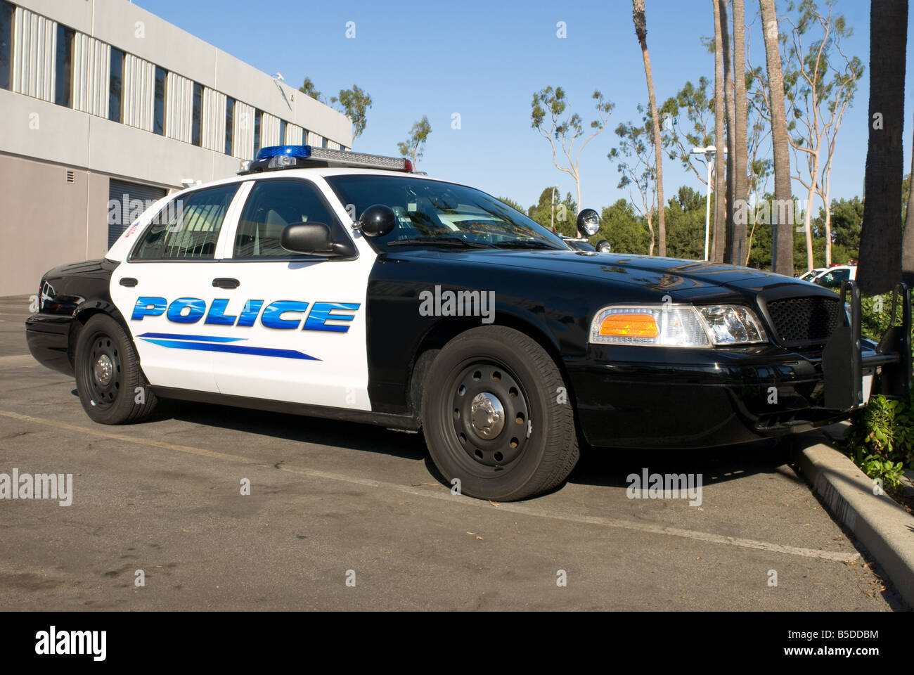 A new police car sitting in a parking lot awaits a driver Stock Photo ...