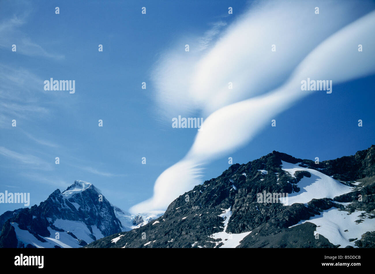 Lenticular clouds over landscape of mountains in South Georgia Atlantic ...