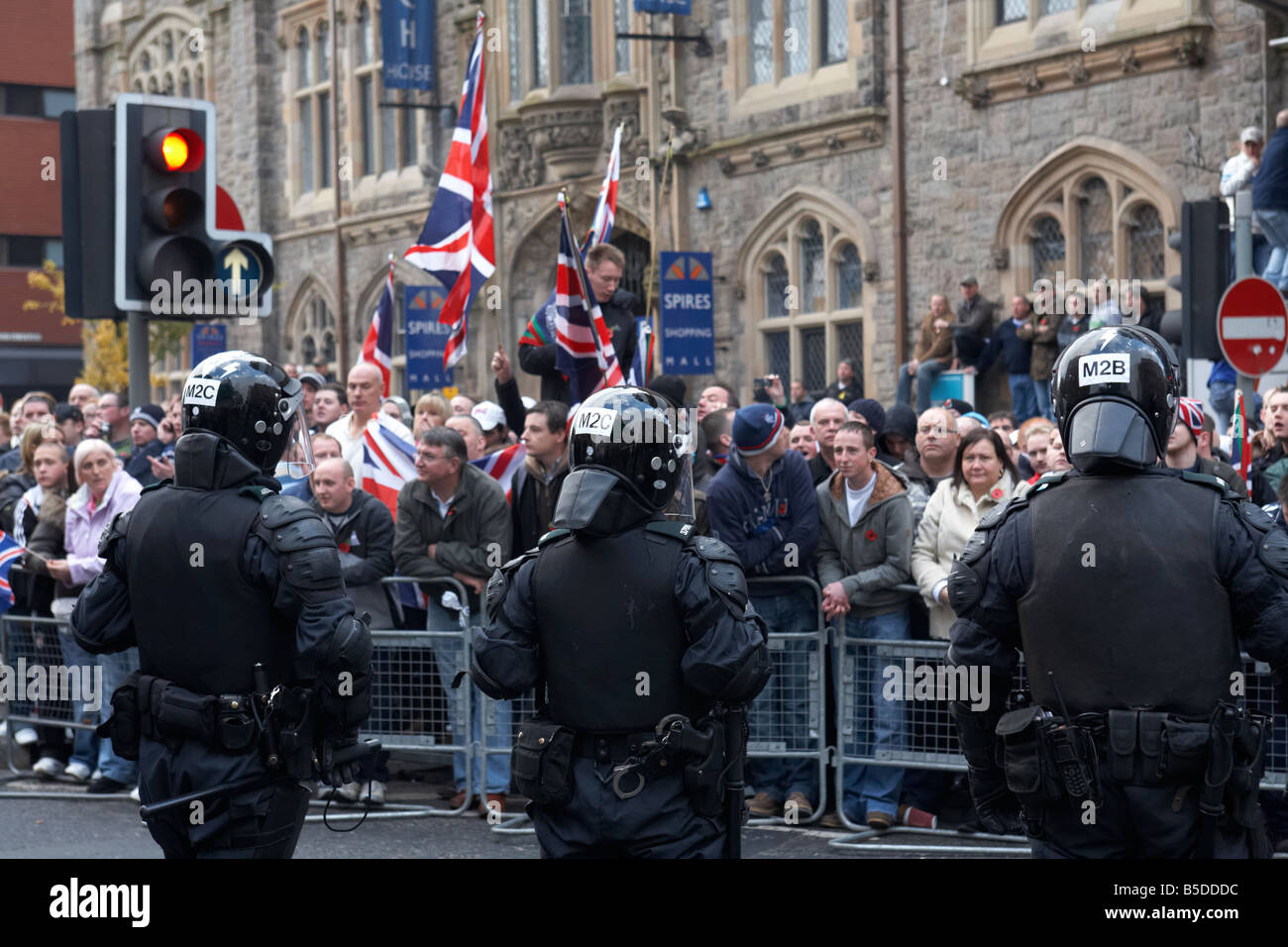 three PSNI Police Service of Northern Ireland riot control officers ...