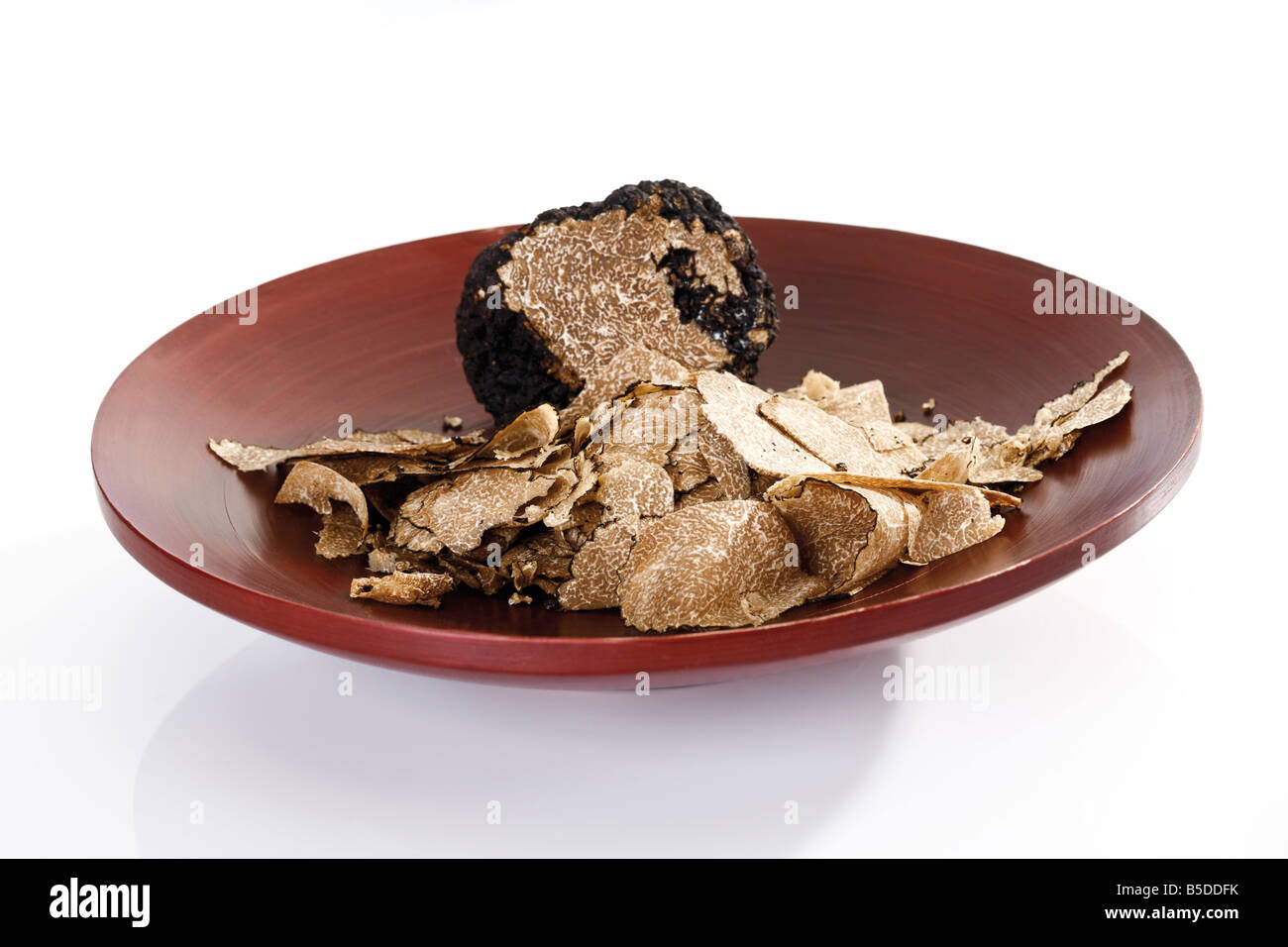 Sliced Truffle on wooden plate Stock Photo - Alamy