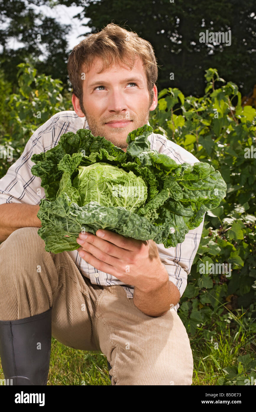 Man holding cabbage, portrait Stock Photo - Alamy