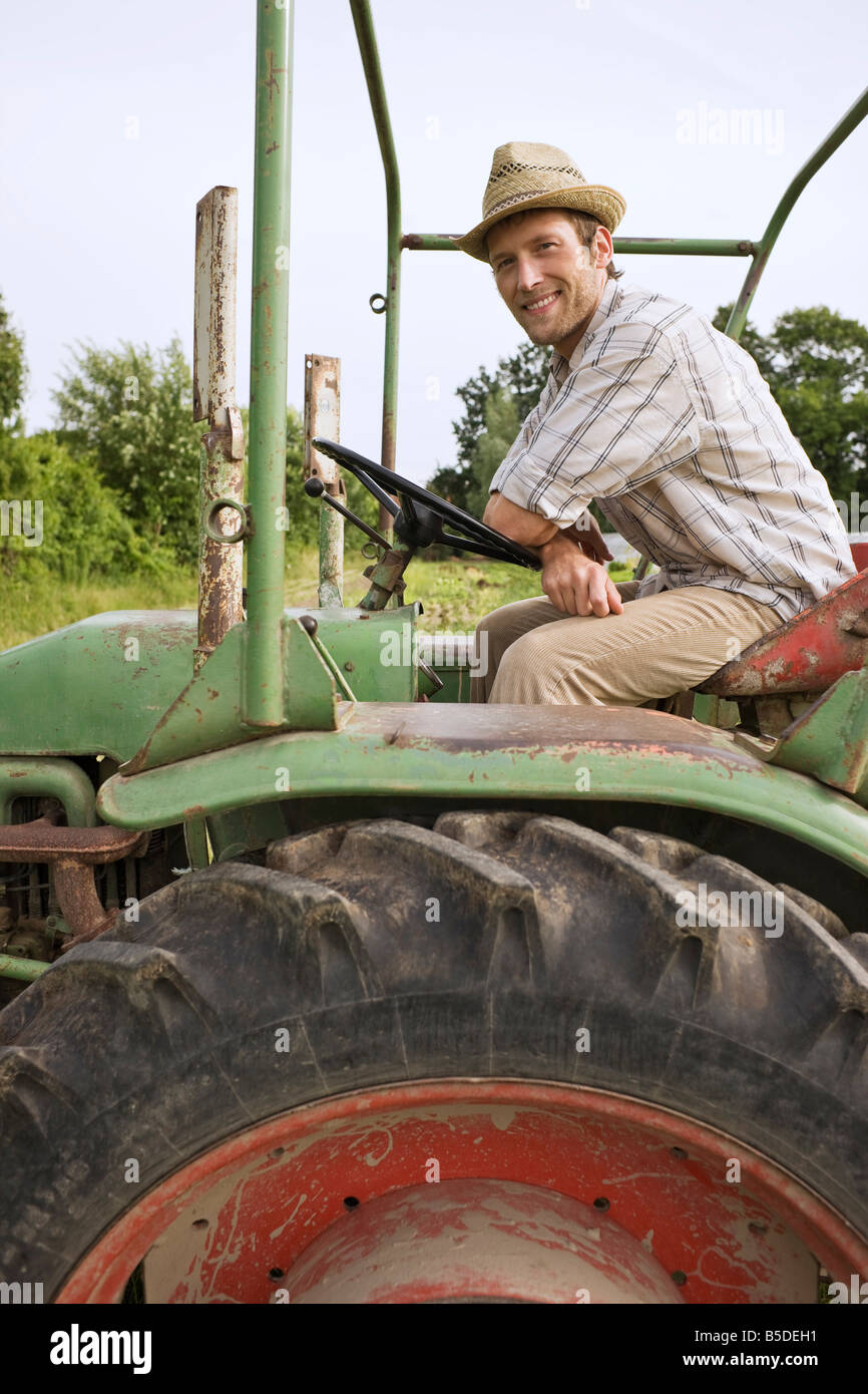 Portrait of a Farmer on a tractor Stock Photo - Alamy