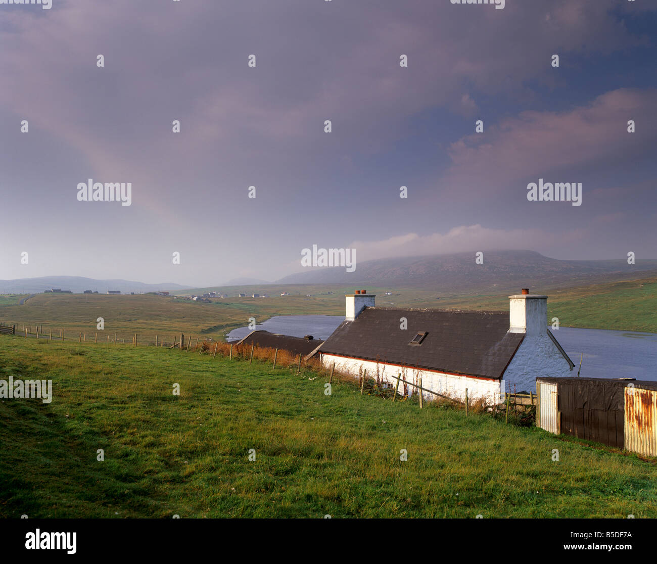 House at Flugarth by loch of Flugarth, and North Roe in the distance ...