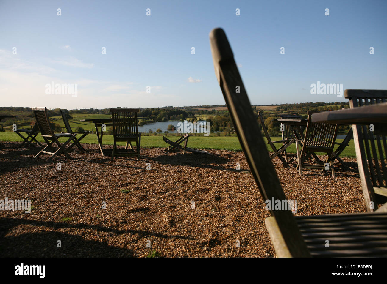 a landscape photograph of a exterior dinning area of a golf course ...