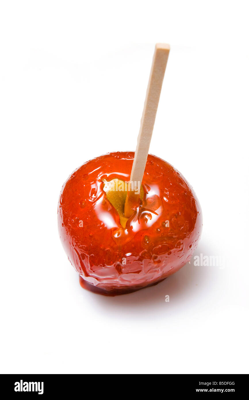 Toffee apple isolated on a white studio background Stock Photo - Alamy