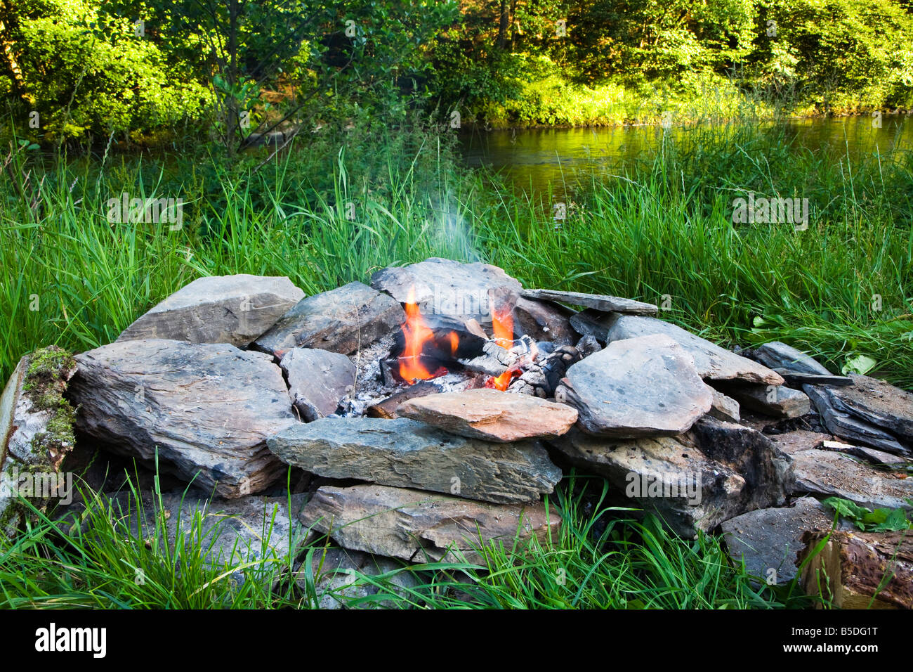 Campfire at twilight Stock Photo - Alamy