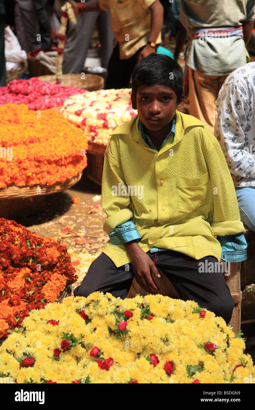 Boy selling flowers in a flower market, Bangalore India Stock Photo - Alamy