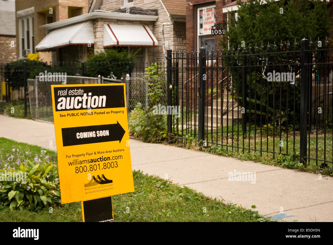 Public auction sign posted outside a foreclosed home in Chicago IL ...