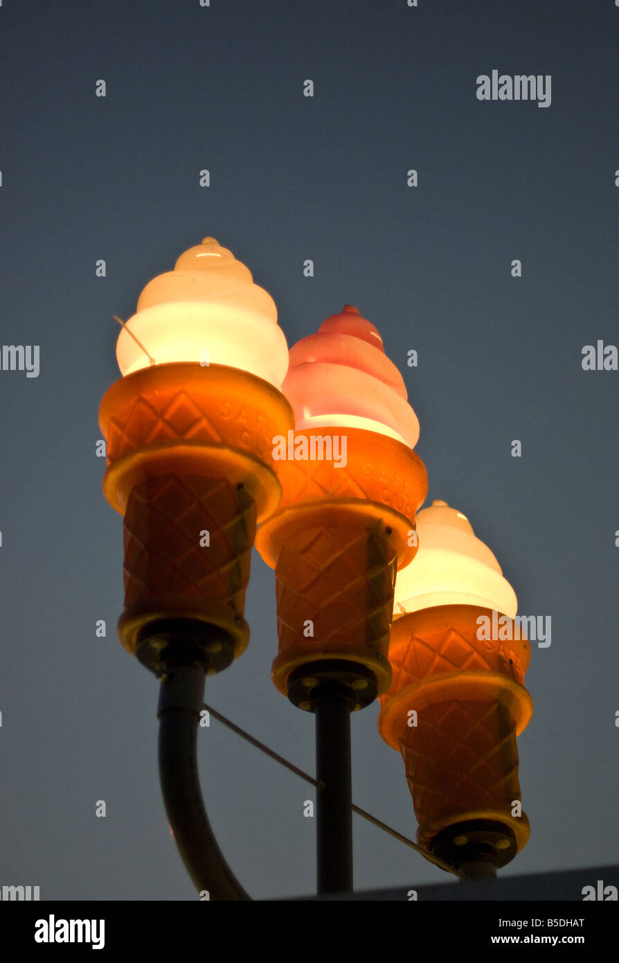Lit up ice cream cones at night at a concession stand Stock Photo - Alamy
