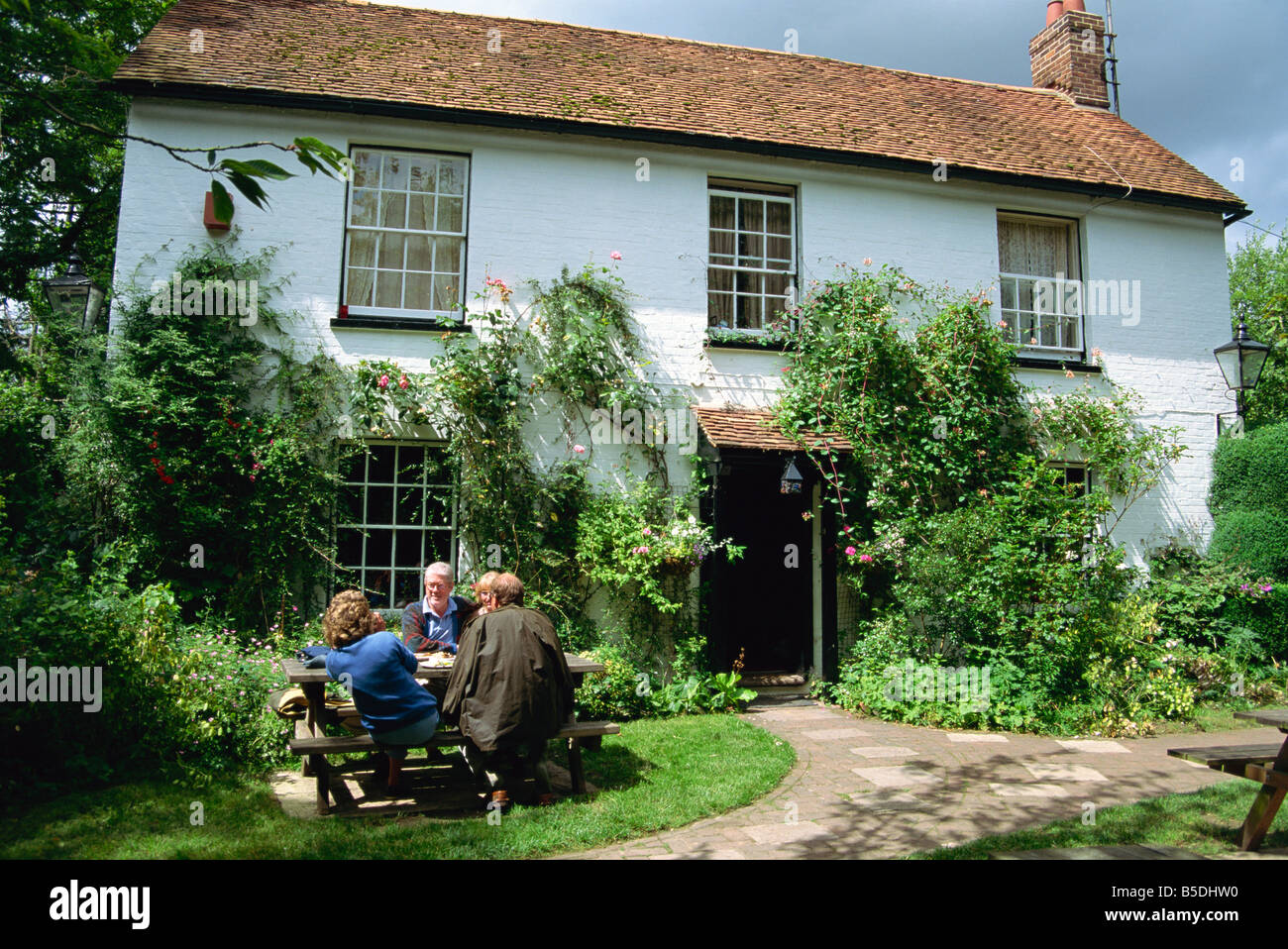 People sitting outside the Bush Inn Ovington Hampshire England UK J ...