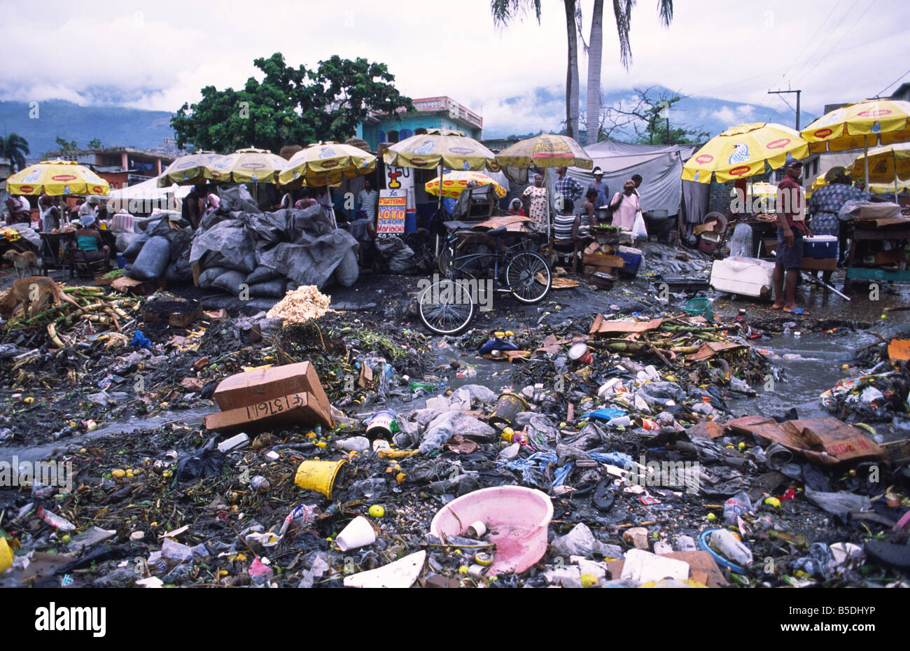 Garbage waste and disease accumulate after the tropical rains in the ...