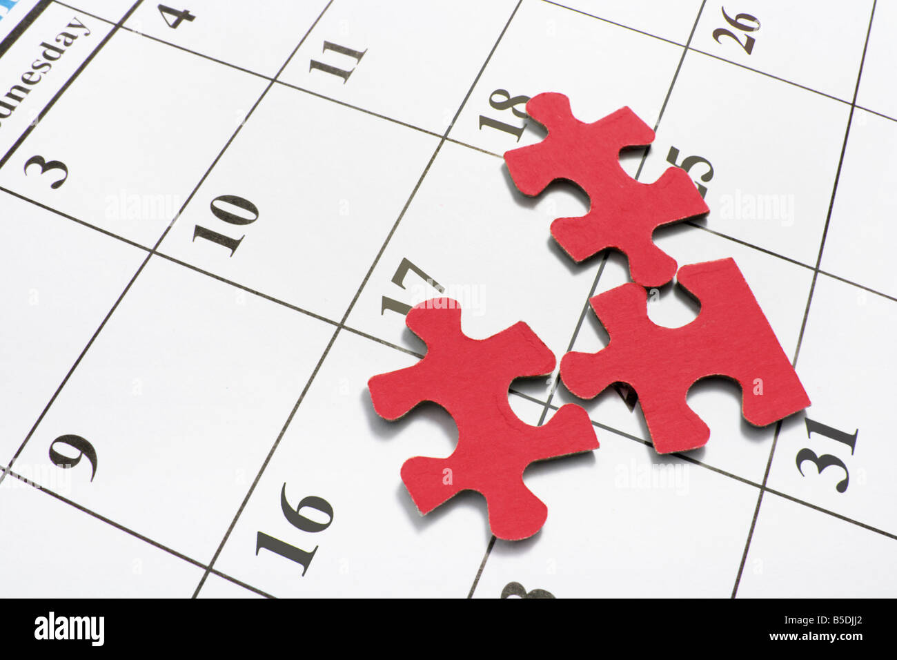 Jigsaw Puzzle Pieces on Calendar Stock Photo - Alamy