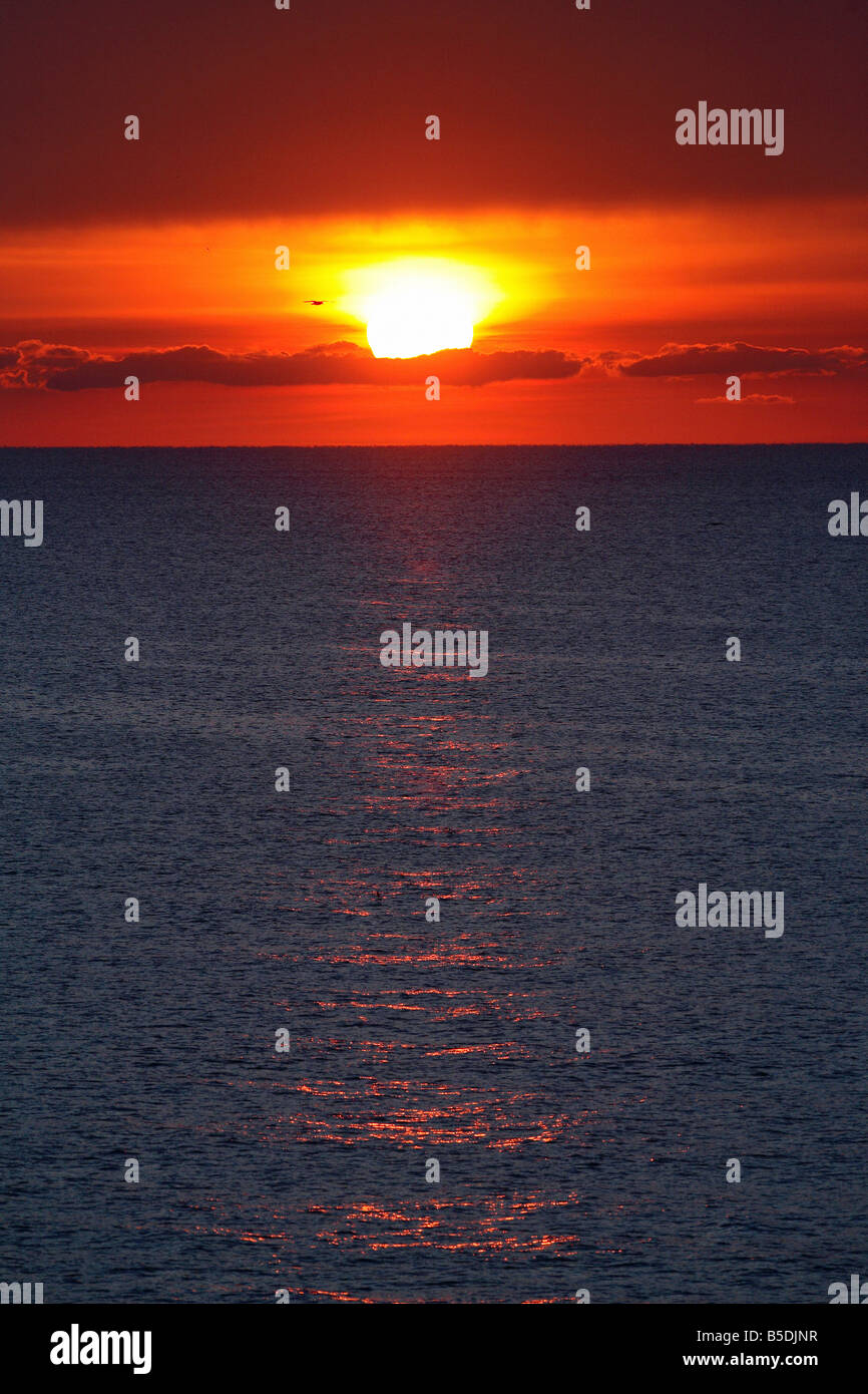 Sunset over the sea Stock Photo - Alamy