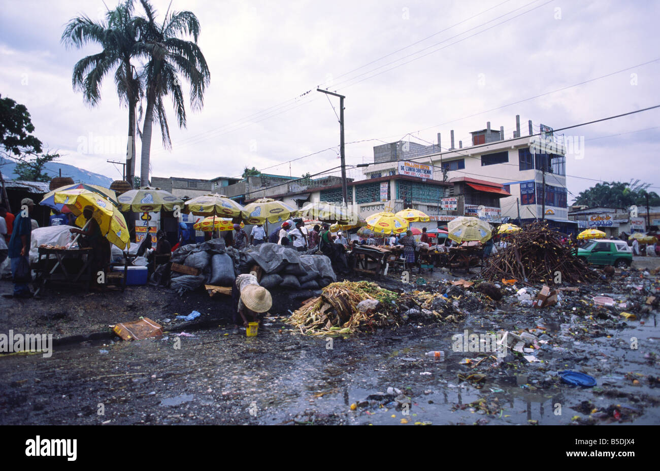 Garbage waste and disease accumulate after the tropical rains in the ...