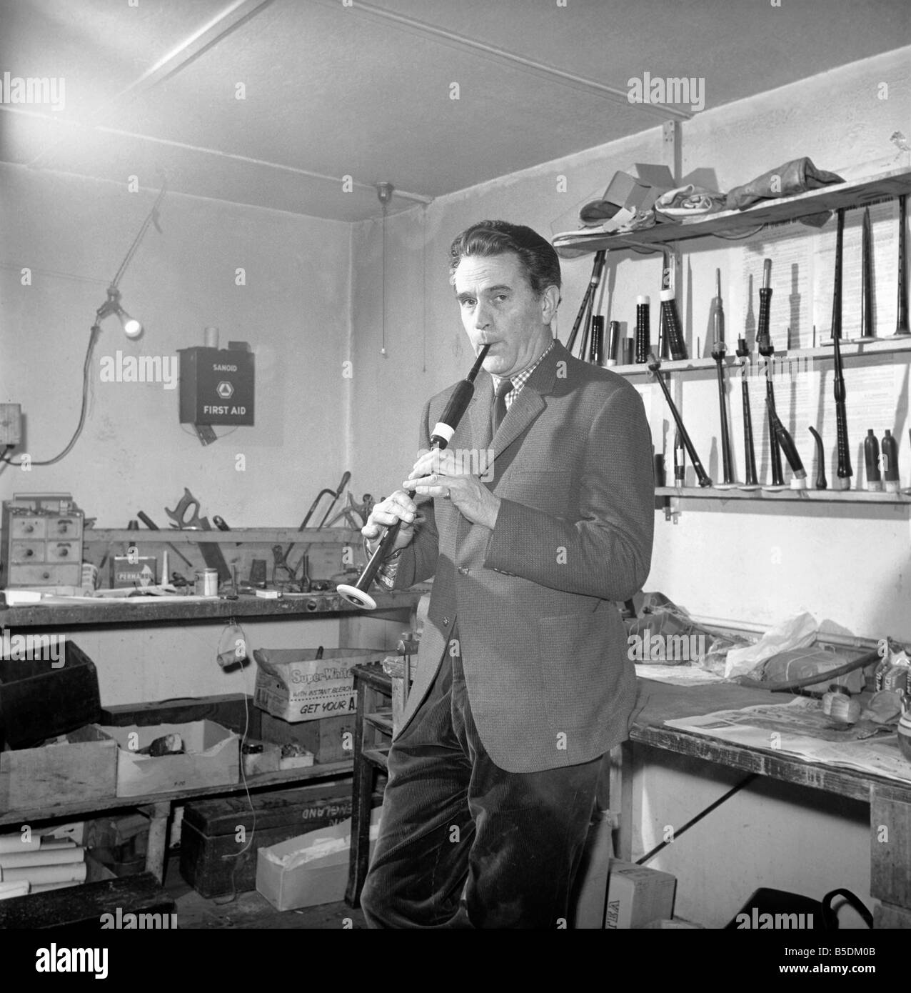 Bagpipe maker Mr. George Alexander seen here in his workshop. Circa ...