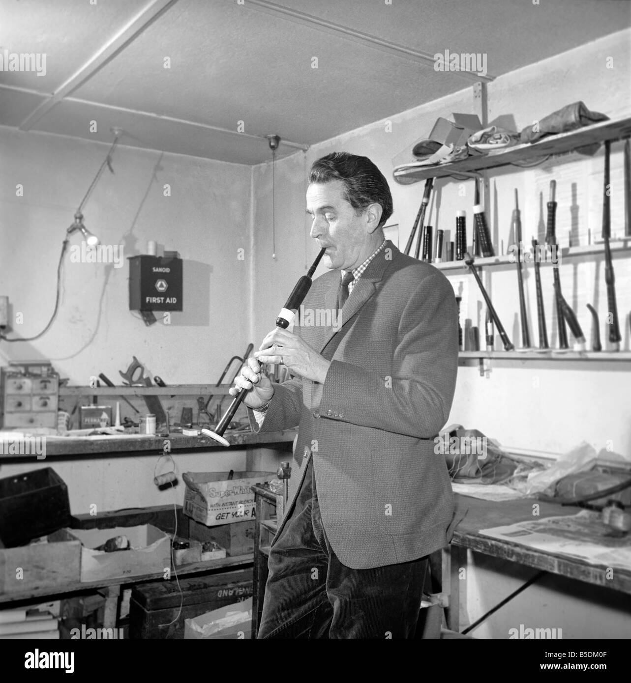Bagpipe maker Mr. George Alexander seen here in his workshop. Circa ...