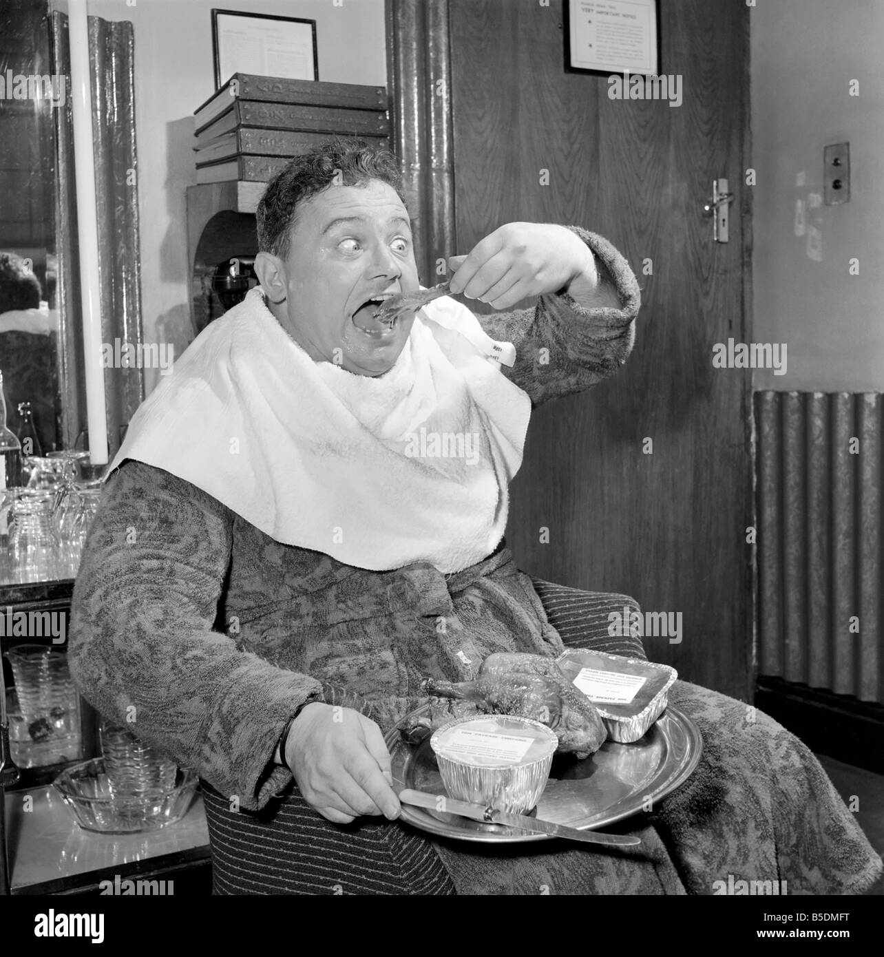 Actor and singer Harry Secombe seen here ordering and then eating a ...