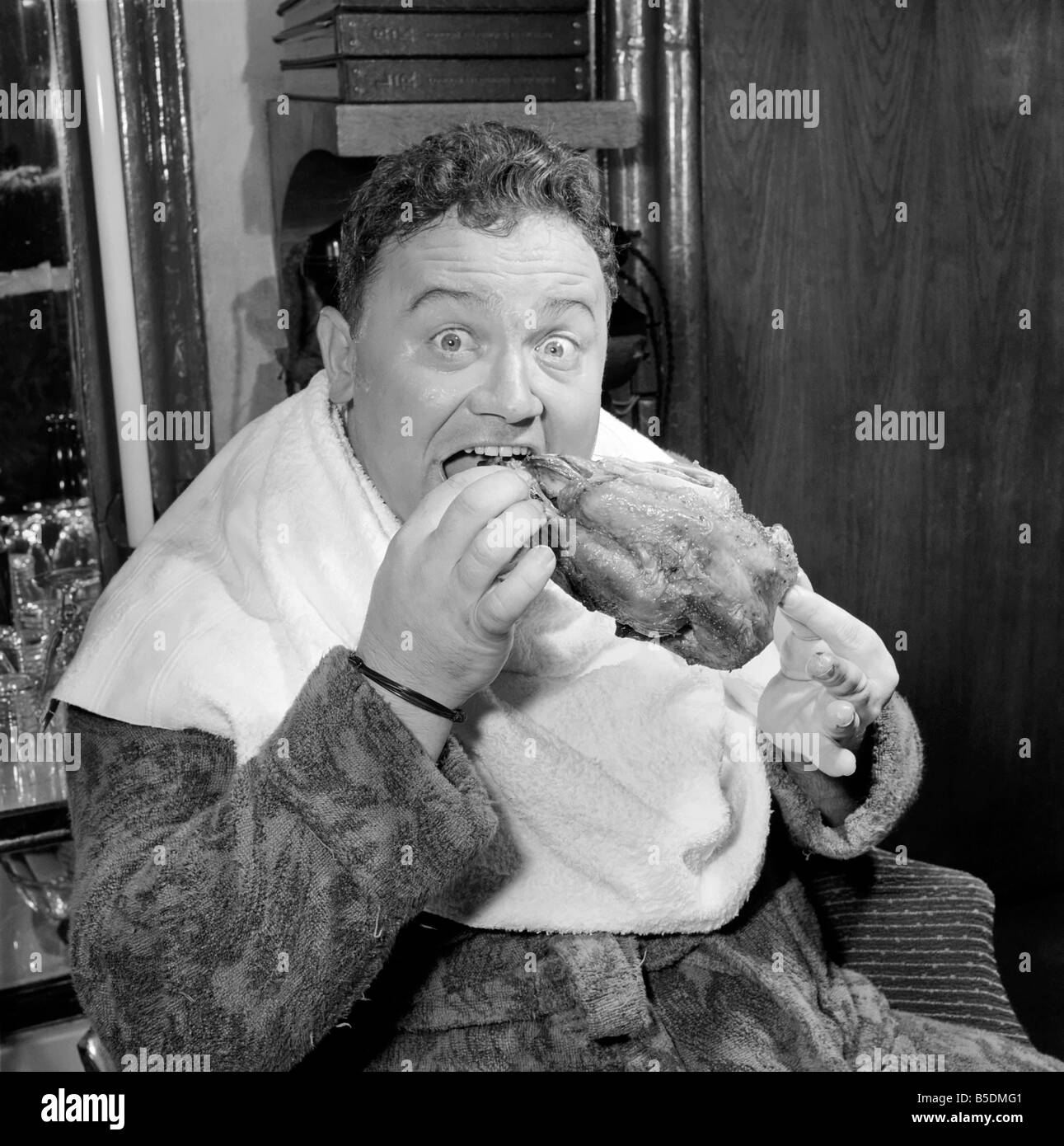 Actor and singer Harry Secombe seen here ordering and then eating a ...