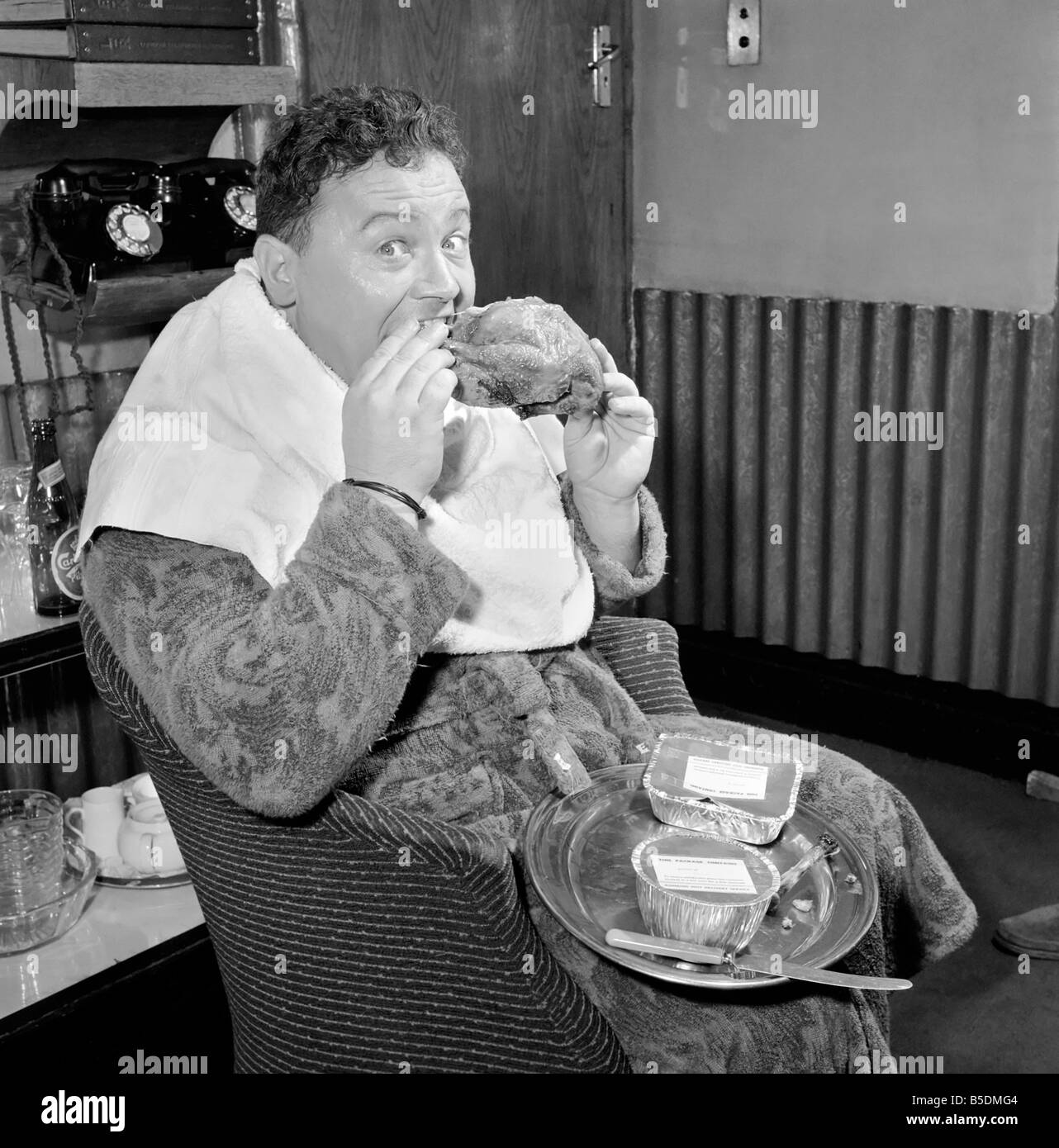 Actor and singer Harry Secombe seen here ordering and then eating a ...