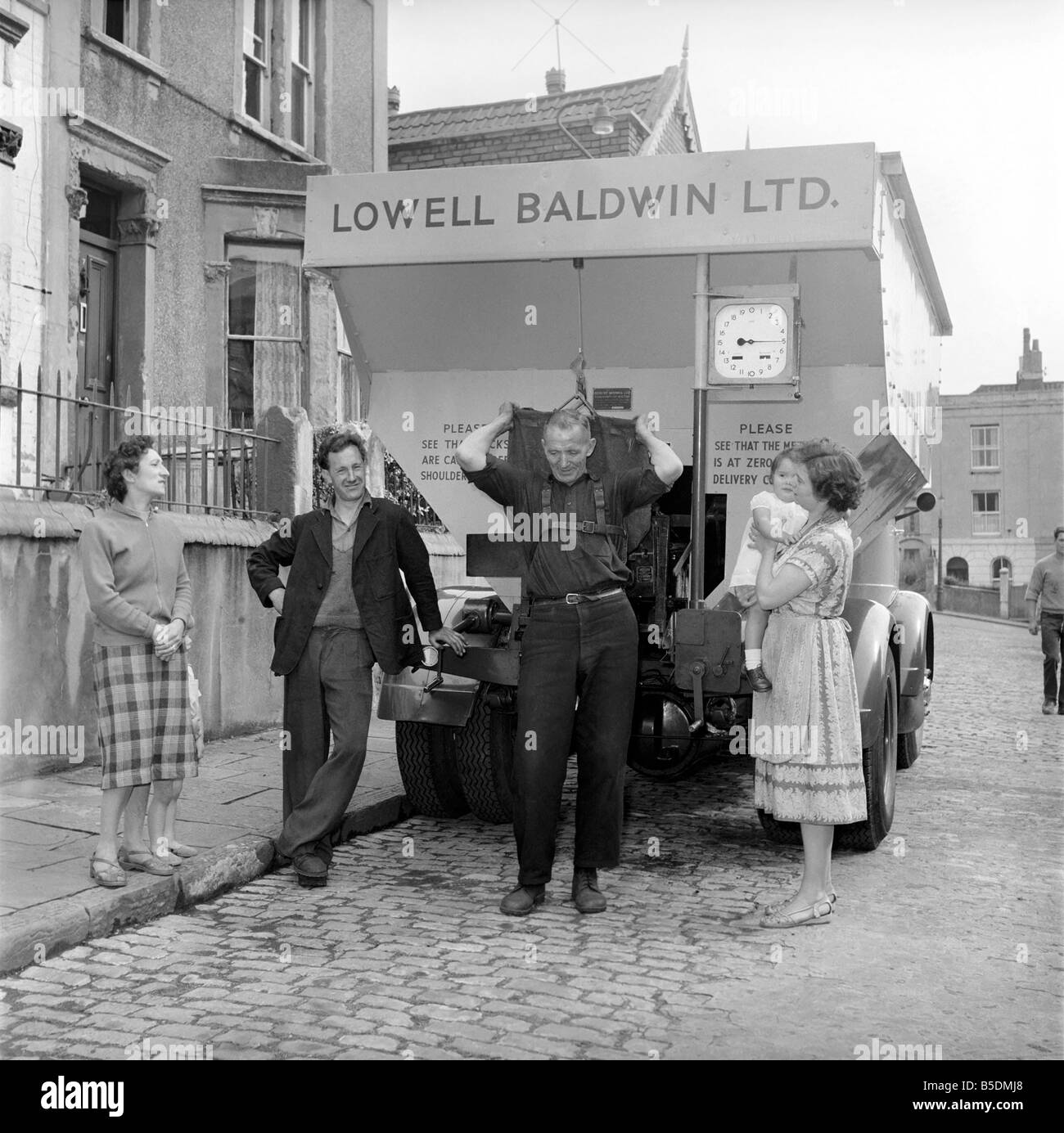 Bristol coal delivery, coal man weighs out delivery. Circa 1957 Stock ...