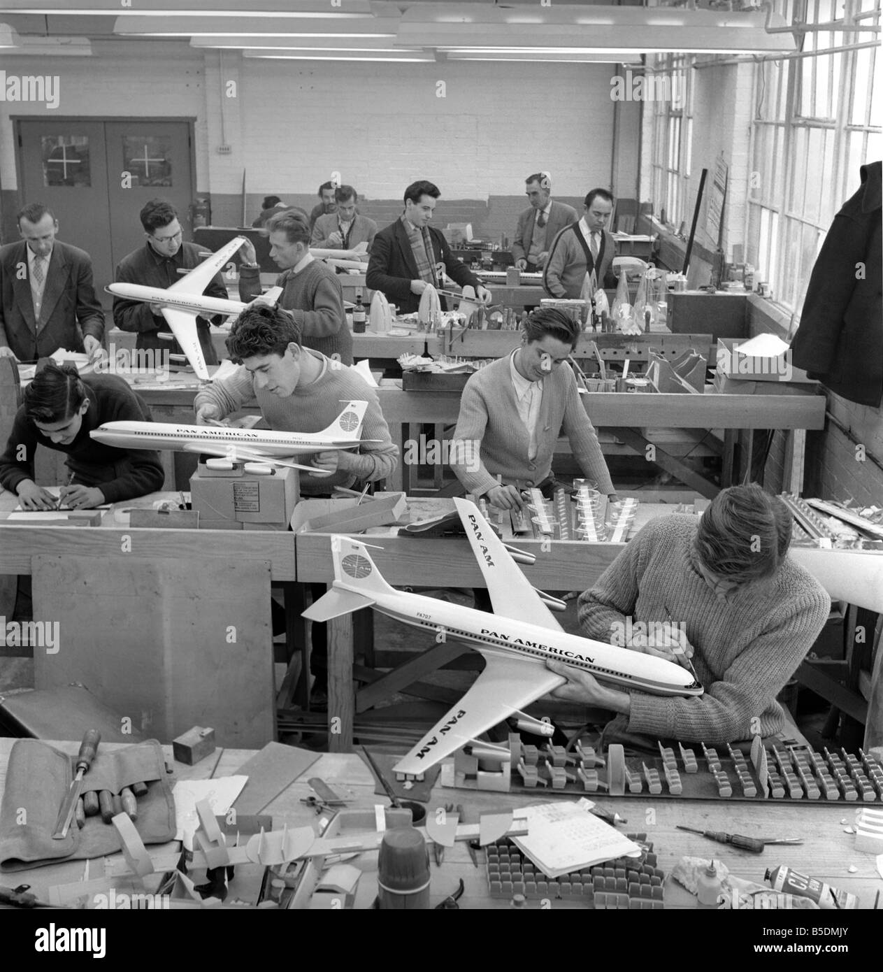 Factory where model aircraft for the travel agents are made. Men making ...