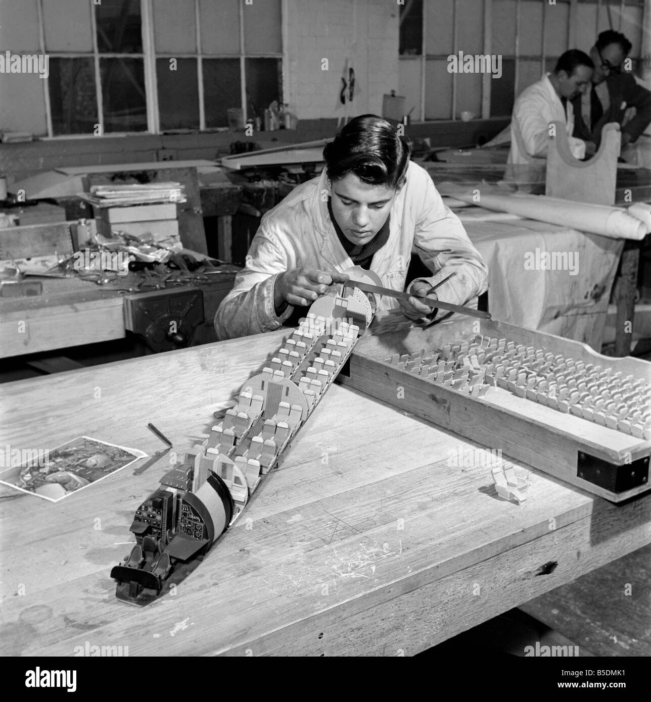 Factory where model aircraft for the travel agents are made. Men making ...