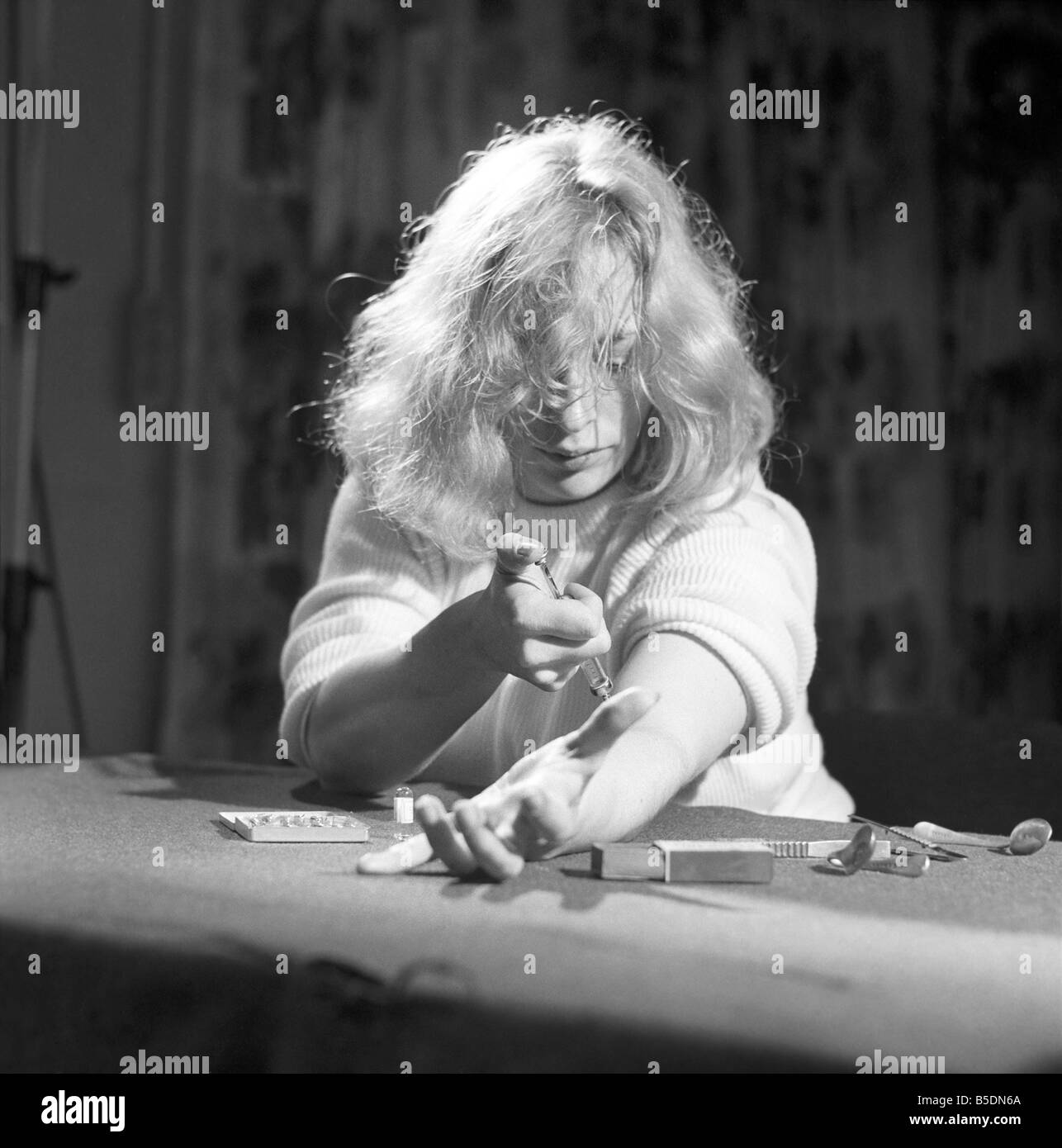 Model shot: Drug addict seen here taking drugs. 1960 A1217-001 Stock ...