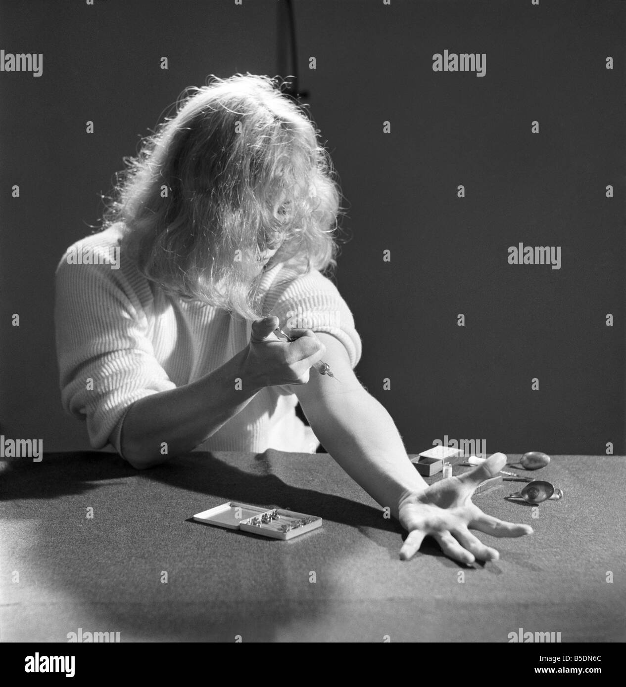 Model shot: Drug addict seen here taking drugs. 1960 A1217-002 Stock ...