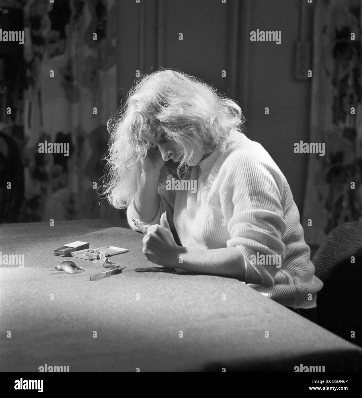 Model shot: Drug addict seen here taking drugs. 1960 A1217-006 Stock ...