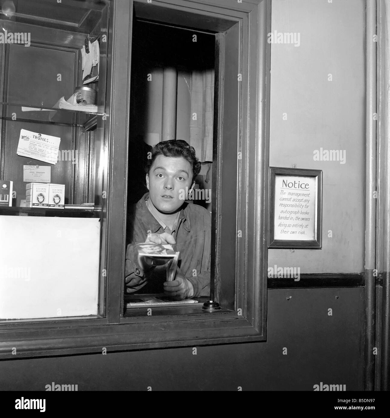 Singer Dickie Valentine seen here getting ready to perform on stage ...