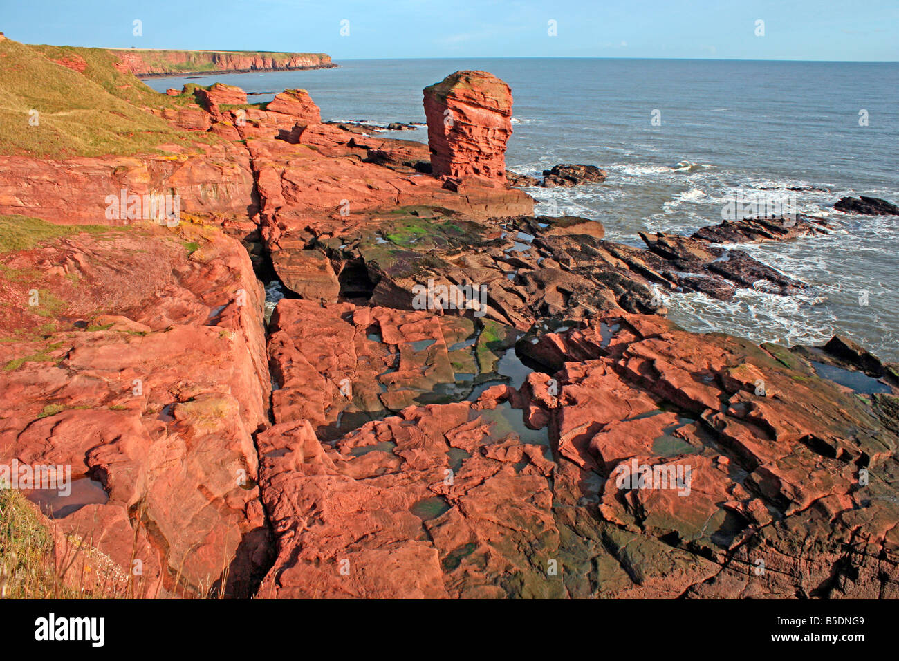 A view of the Deil's Head sandstone rock sea stack Stock Photo - Alamy