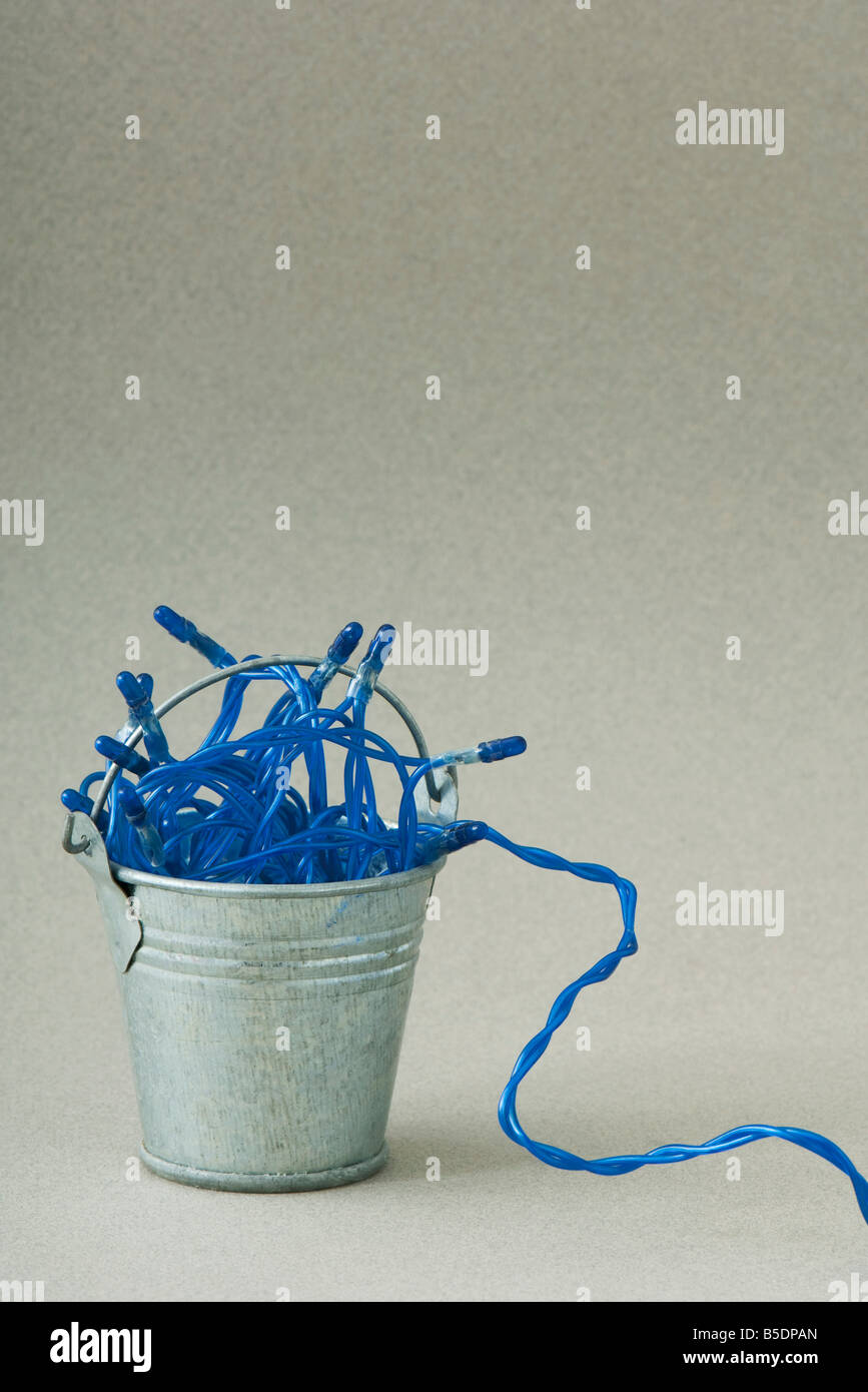 Miniature bucket filled with blue Christmas tree lights Stock Photo - Alamy