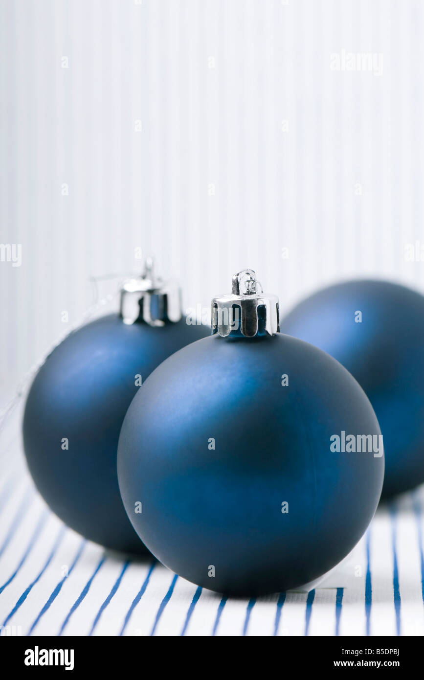 Three blue Christmas tree ornaments Stock Photo - Alamy