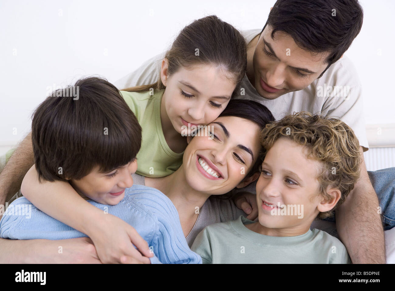 Family enjoying moment of closeness Stock Photo - Alamy