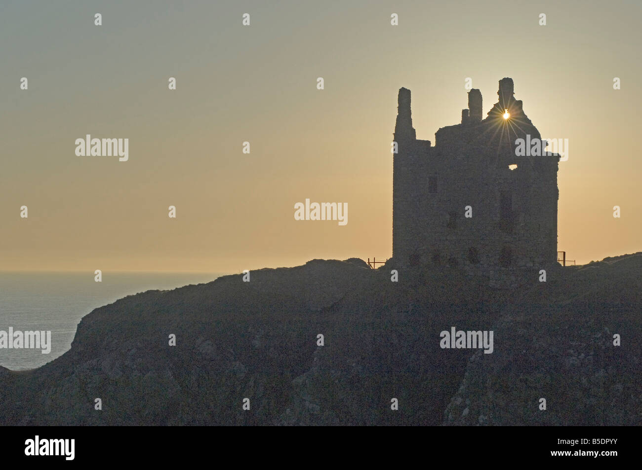 The 16th century clifftop Dunskey Castle, overlooking the Irish Sea ...