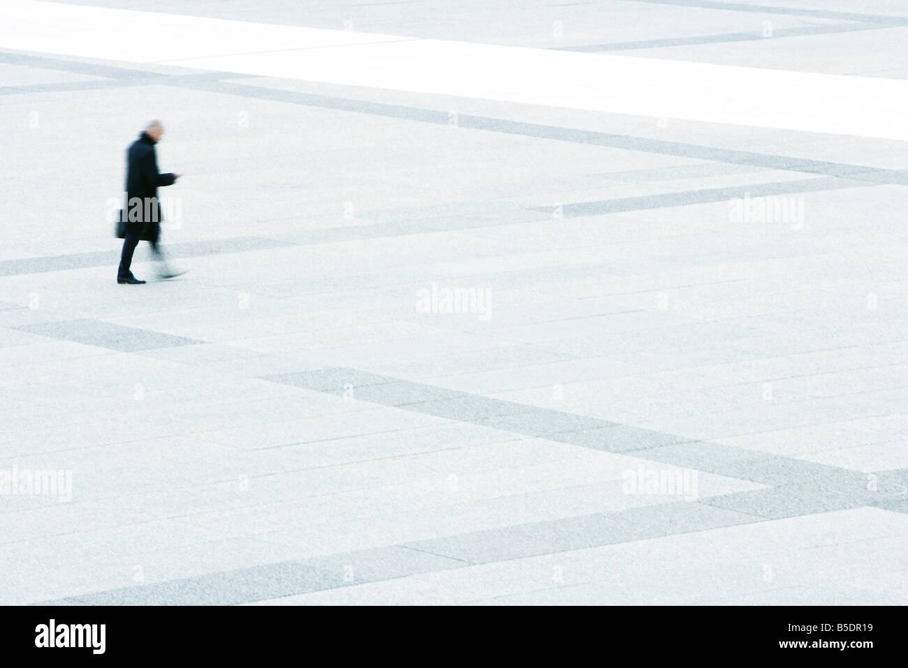 Cell phones people walking looking down hi-res stock photography and ...
