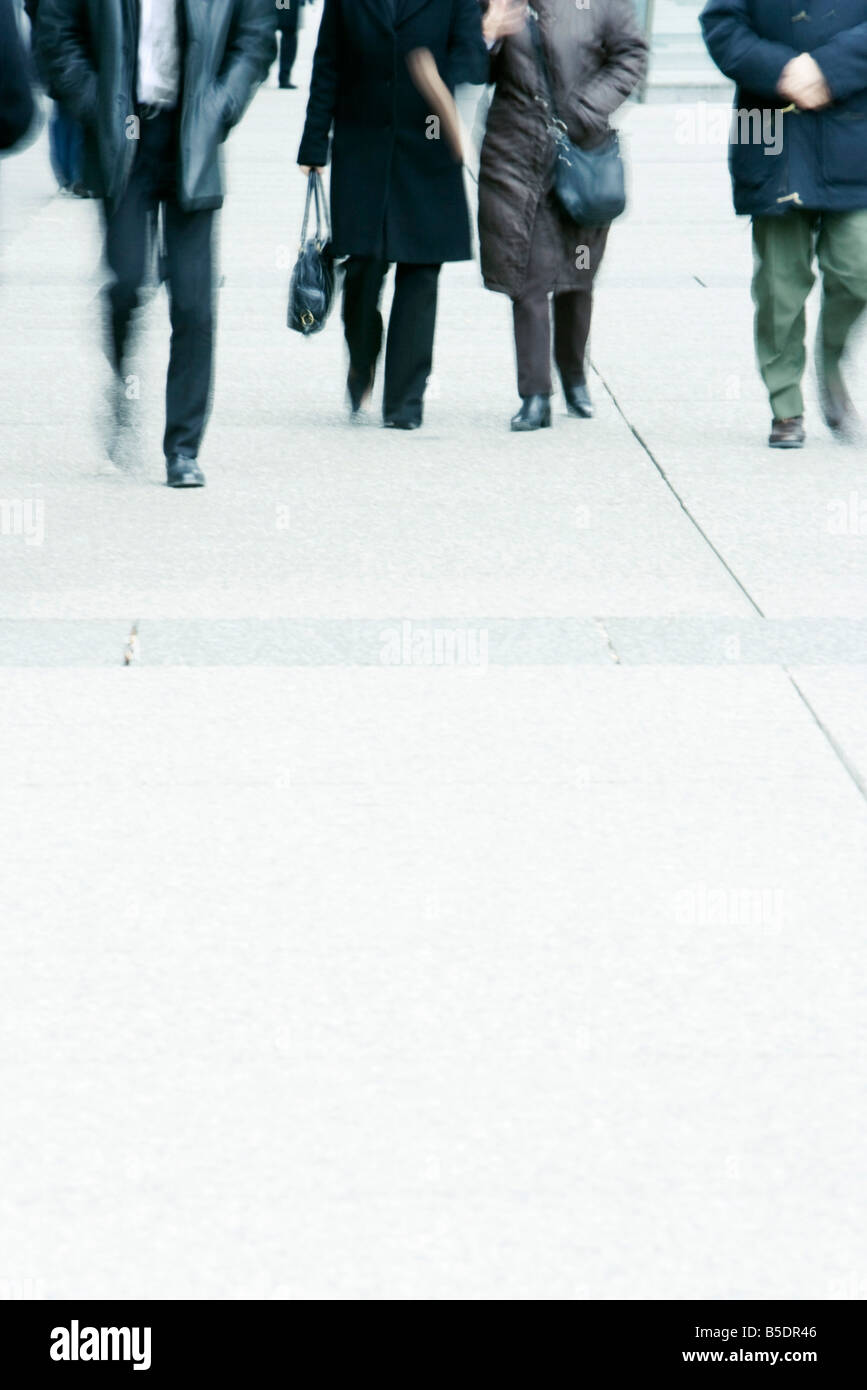 Cropped view of pedestrians on sidewalk Stock Photo - Alamy