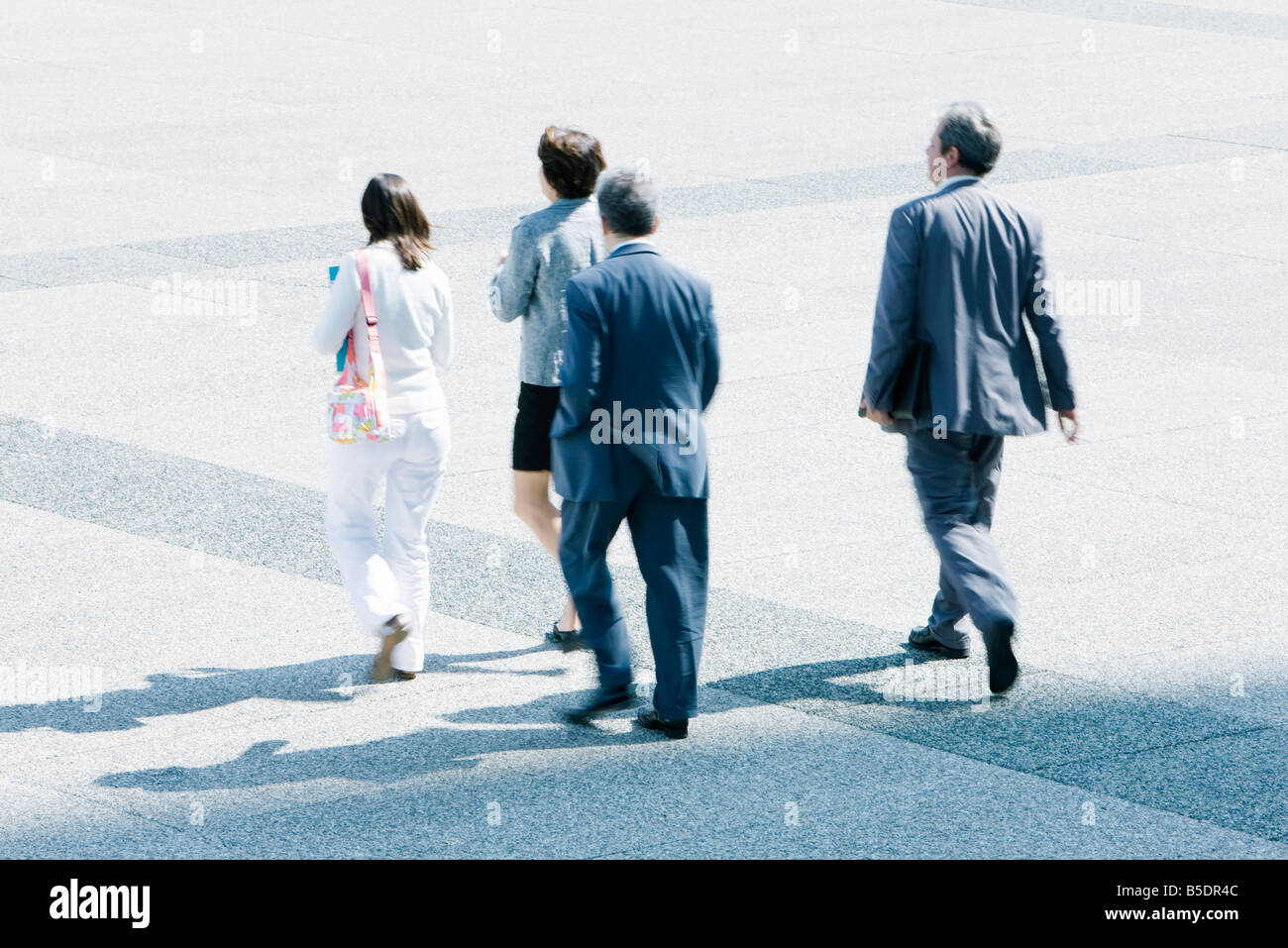 Pedestrians walking across public square Stock Photo - Alamy