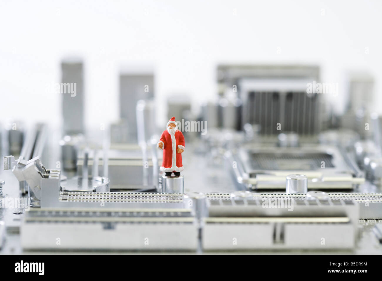 Santa Claus figurine standing on computer motherboard Stock Photo - Alamy