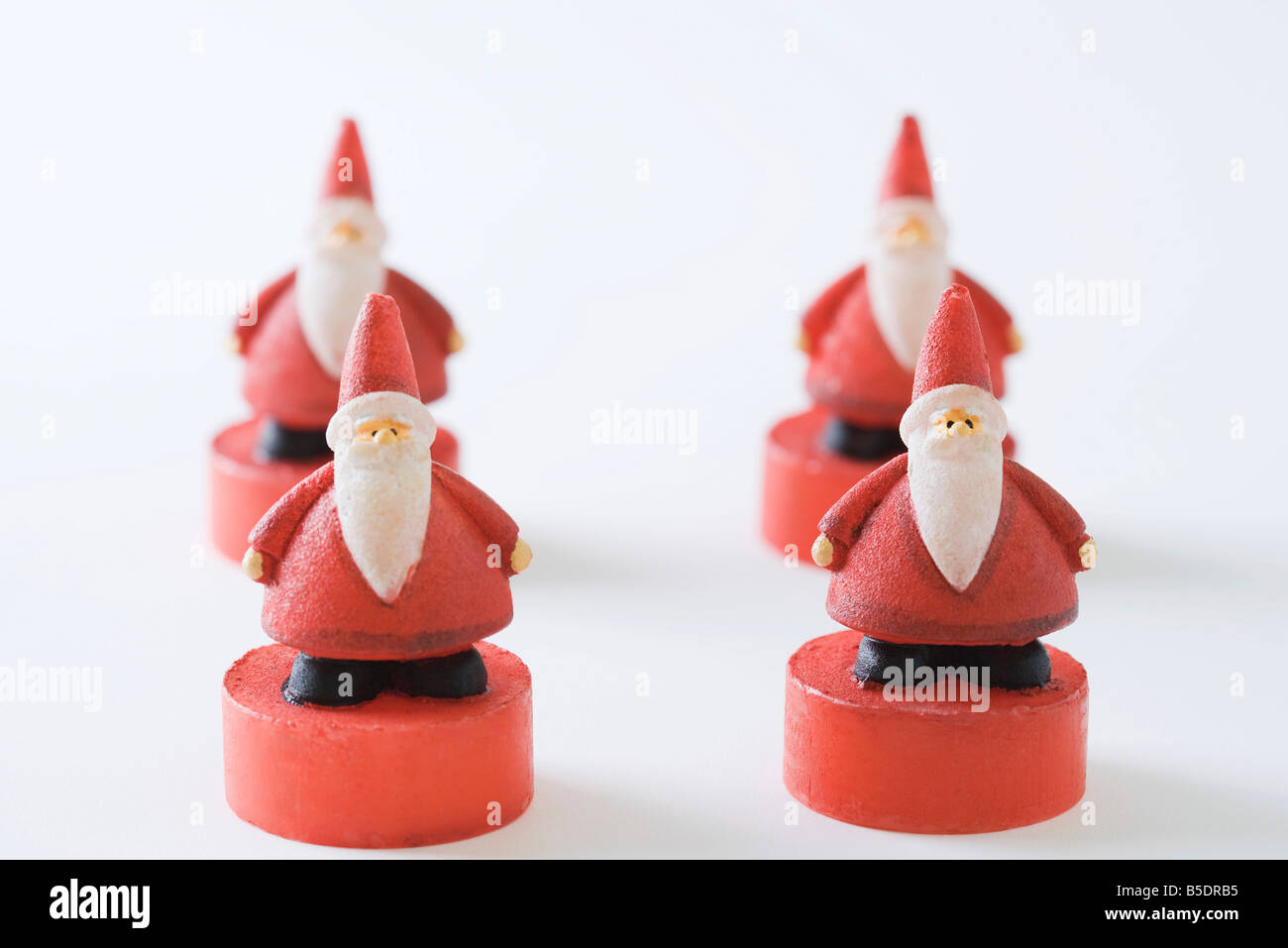 Four Santa Claus figurines Stock Photo - Alamy