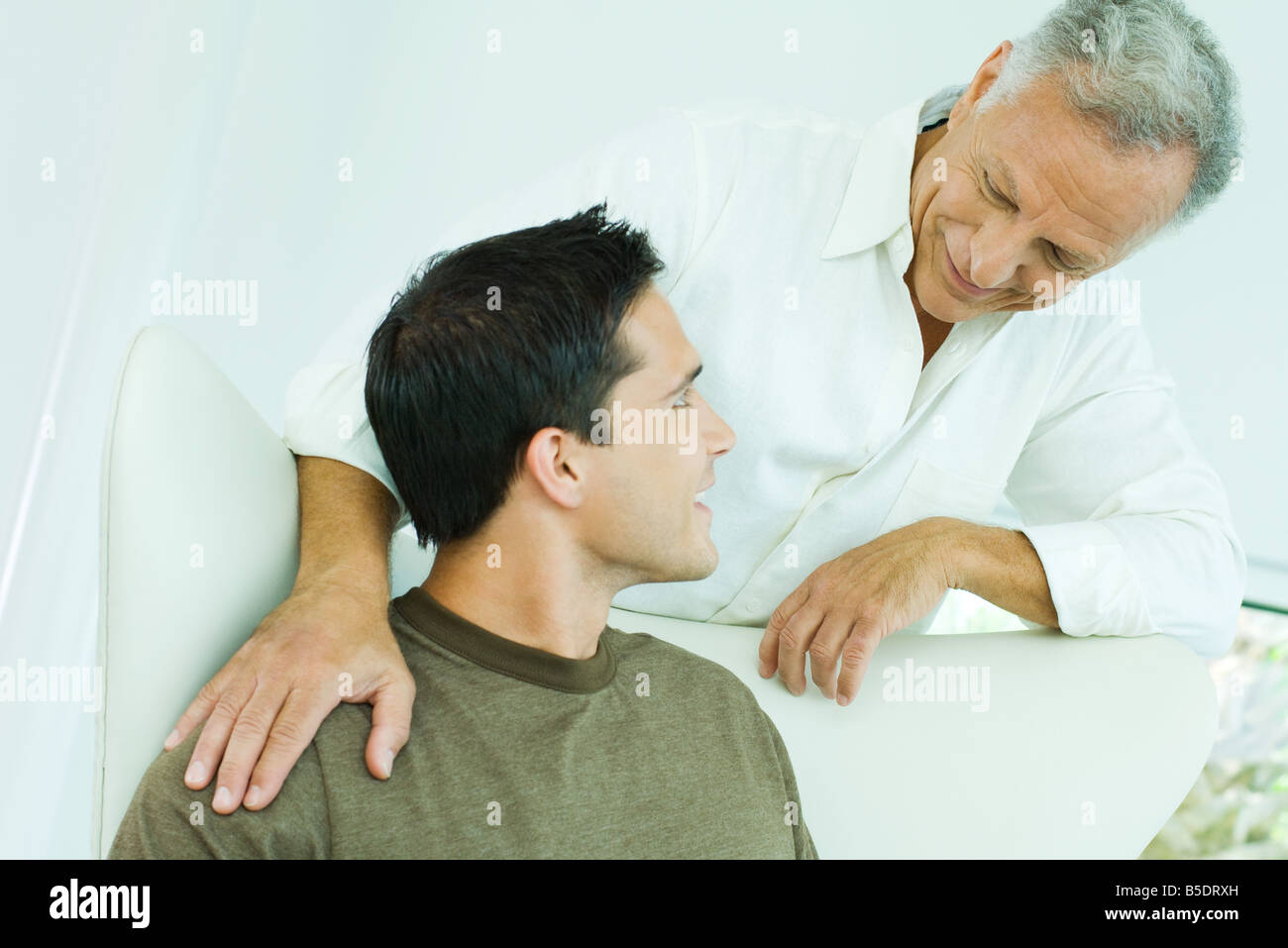 Fathers hand on sons shoulder hi-res stock photography and images - Alamy