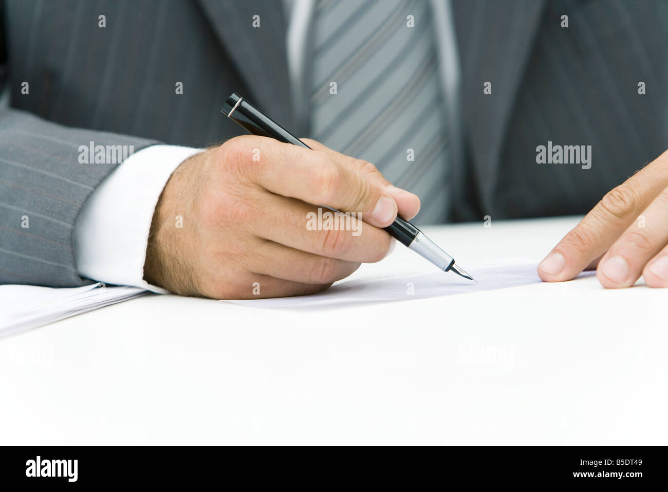 Signing cheques hi-res stock photography and images - Alamy