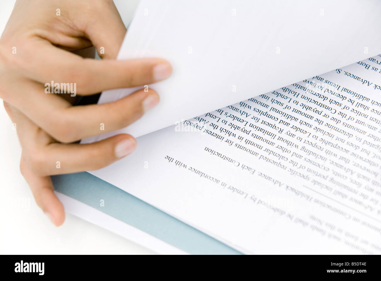 Hand turning document page, close-up Stock Photo - Alamy
