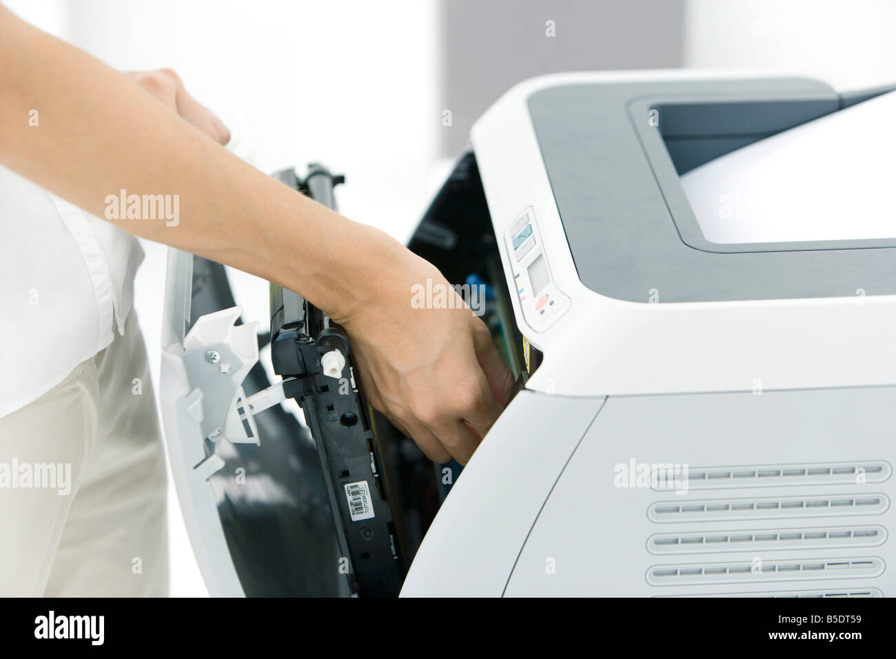 Person fixing printer, cropped view Stock Photo - Alamy