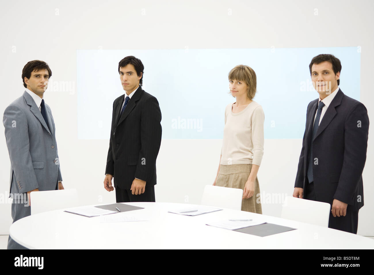 Four smiling businesswomen with file hi-res stock photography and ...