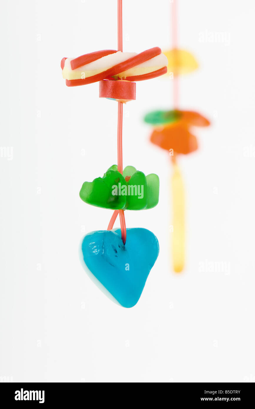 Colorful candy hanging on string Stock Photo - Alamy