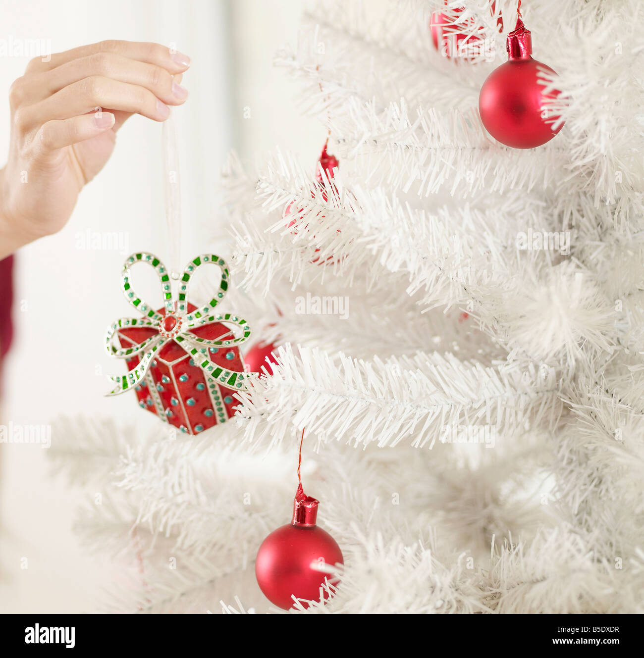 Hand decorating christmas tree baubles hi-res stock photography and ...