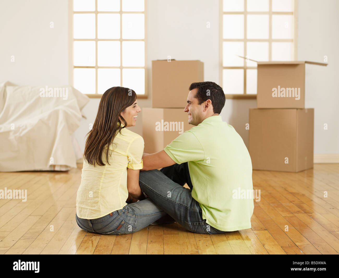 Couple Talking near Cardboard Boxes Stock Photo - Alamy