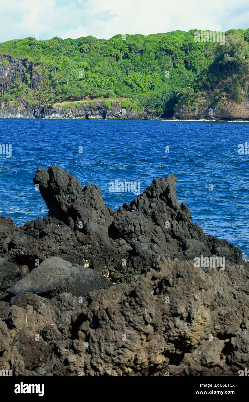 Jagged black lava shore on Keanae Peninsula, Hana Coast road, Maui ...