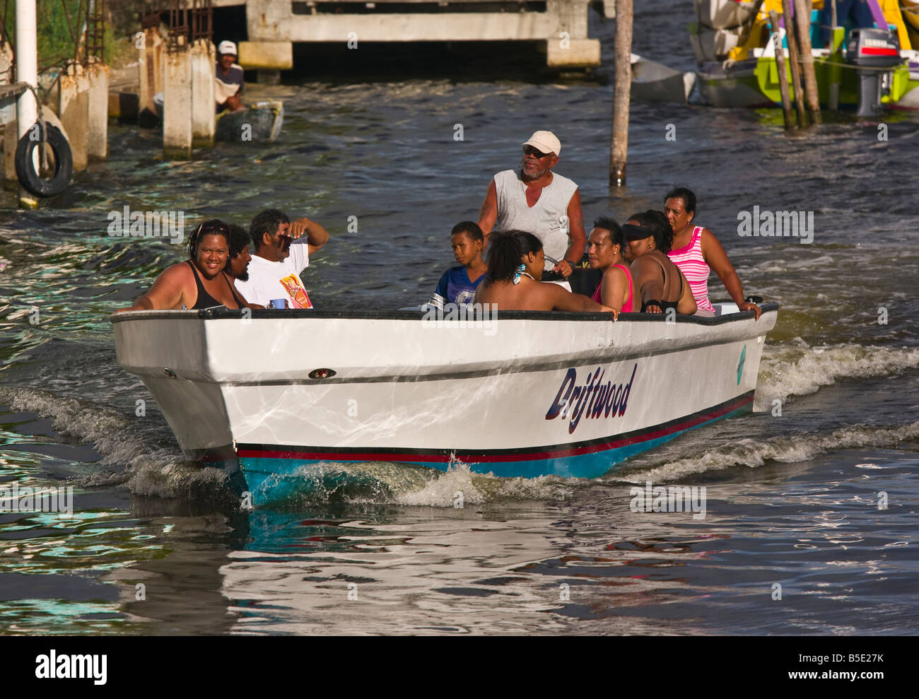 BELIZE CITY BELIZE People in small motorboat arrive in Belize Harbor at ...